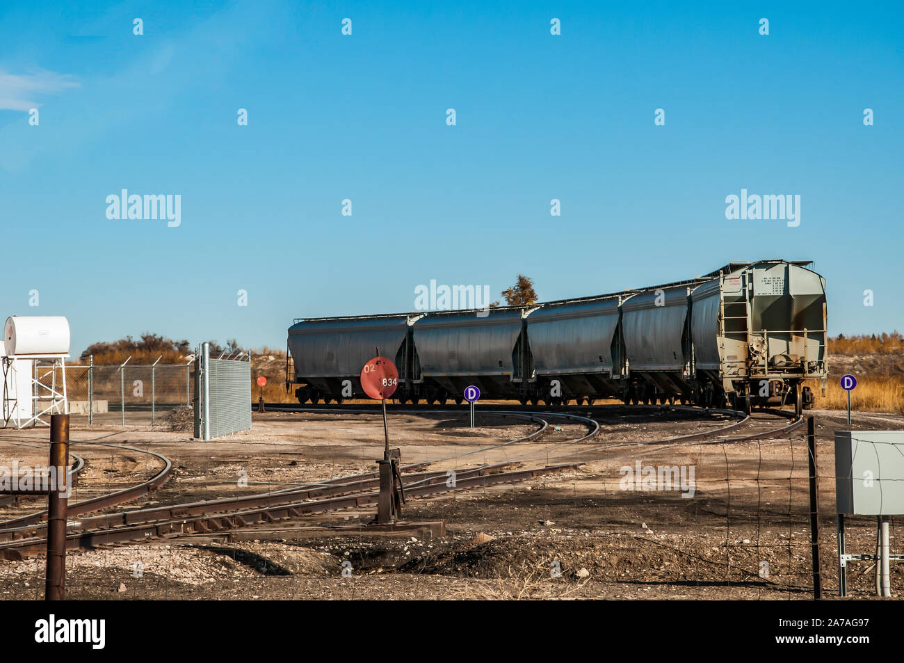 Bulk railroad cars waiting to be loade with grain Stock Photo - Alamy