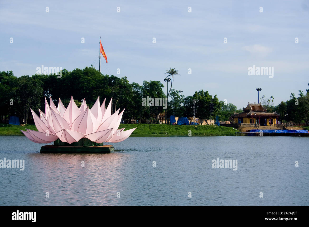 Glowing lotus: An installation of floating lotus flowers on the river ...