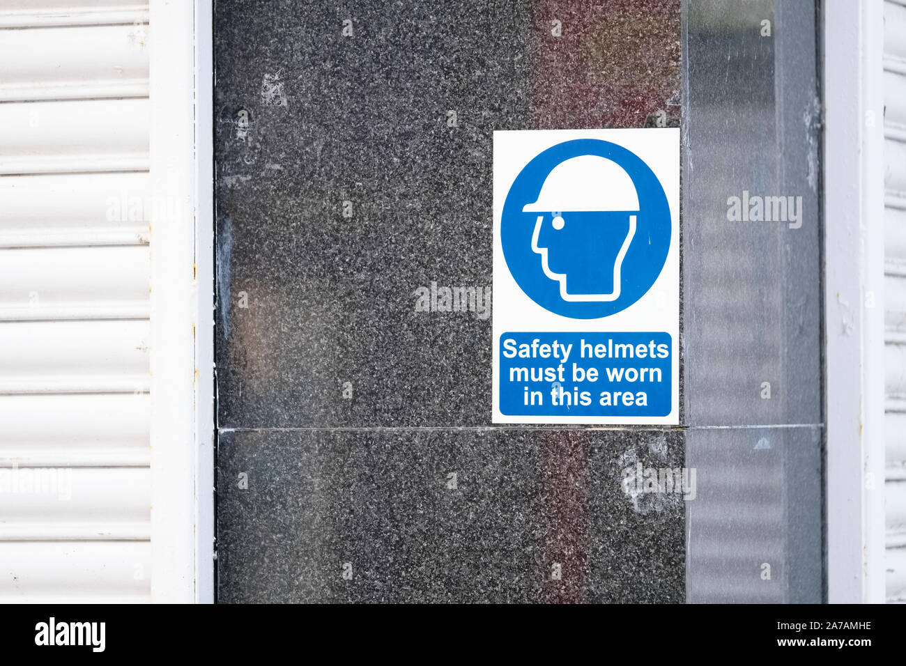 Safety helmets must be worn sign on construction building site Stock ...