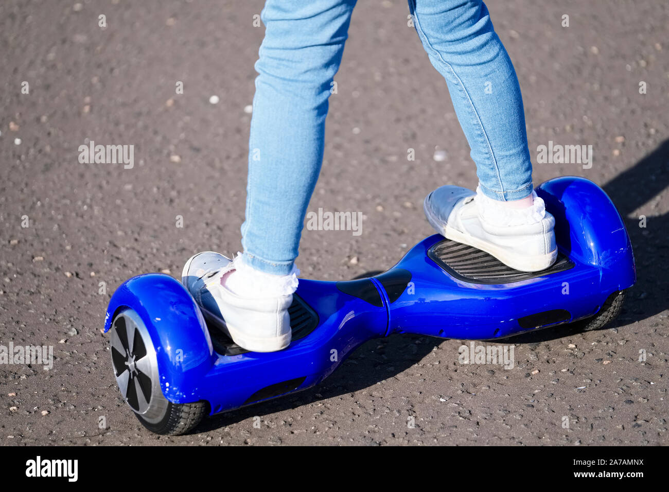 Young girl practising balance activity on hoverboard Stock Photo - Alamy