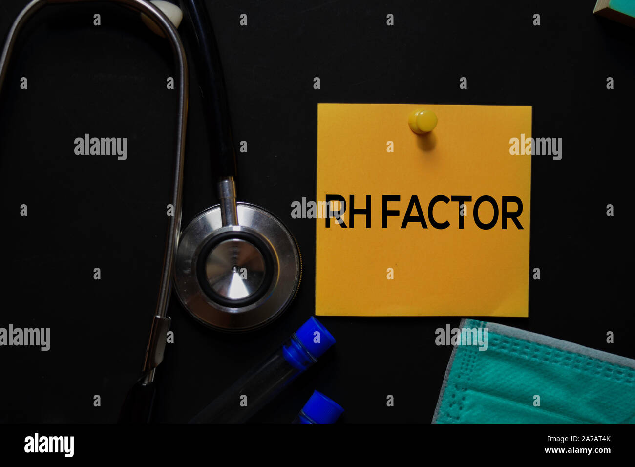 RH Factor text on sticky notes. Office desk background. Medical or ...