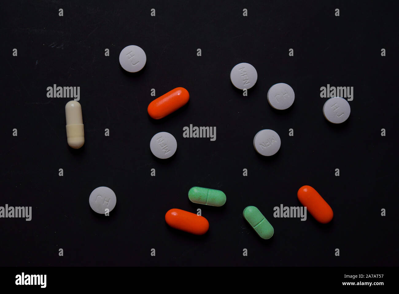 colorful medication and medicine pills, tablets and capsules. Isolated ...