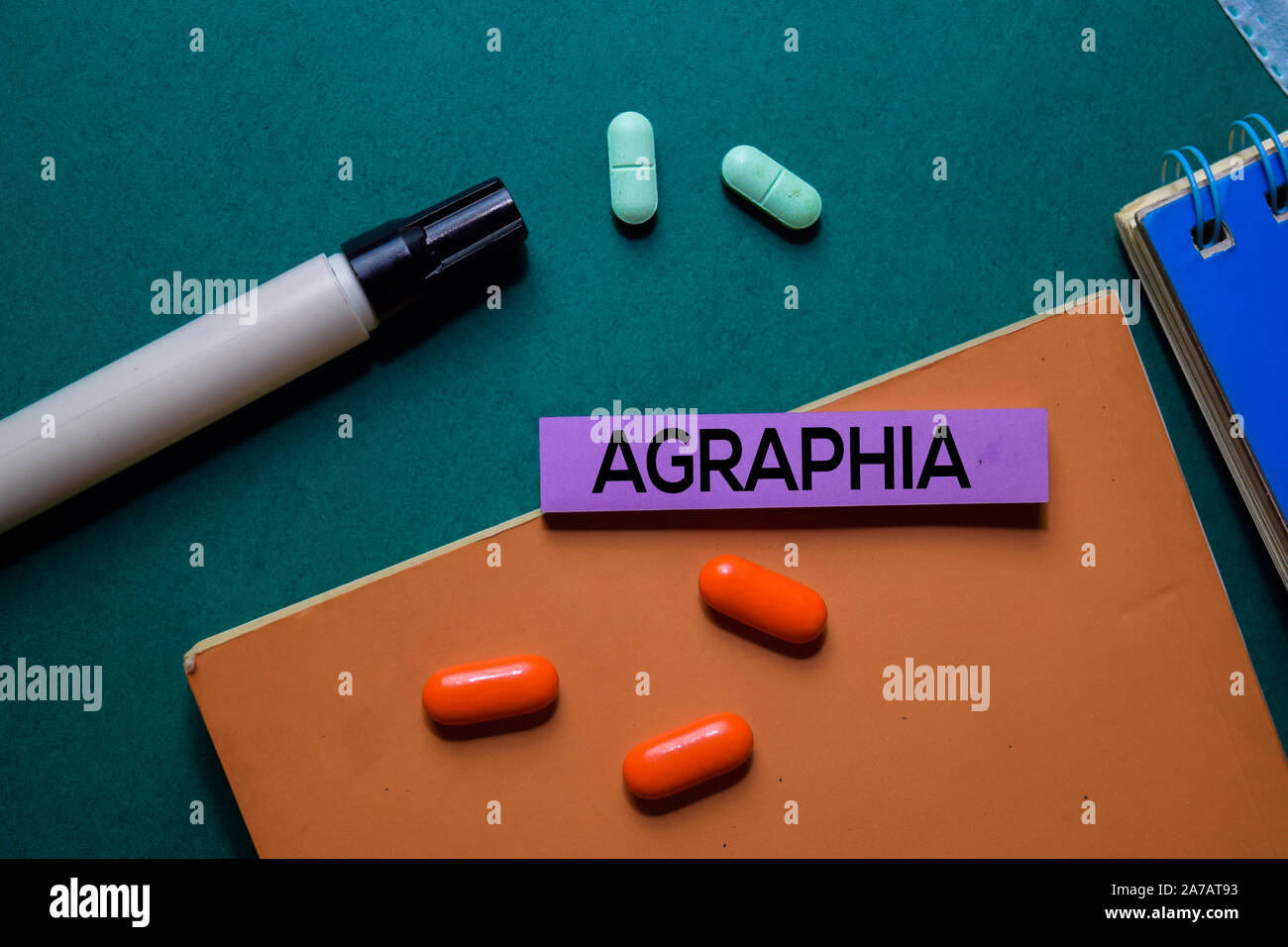 Agraphia text on sticky notes. Office desk background. Medical or ...