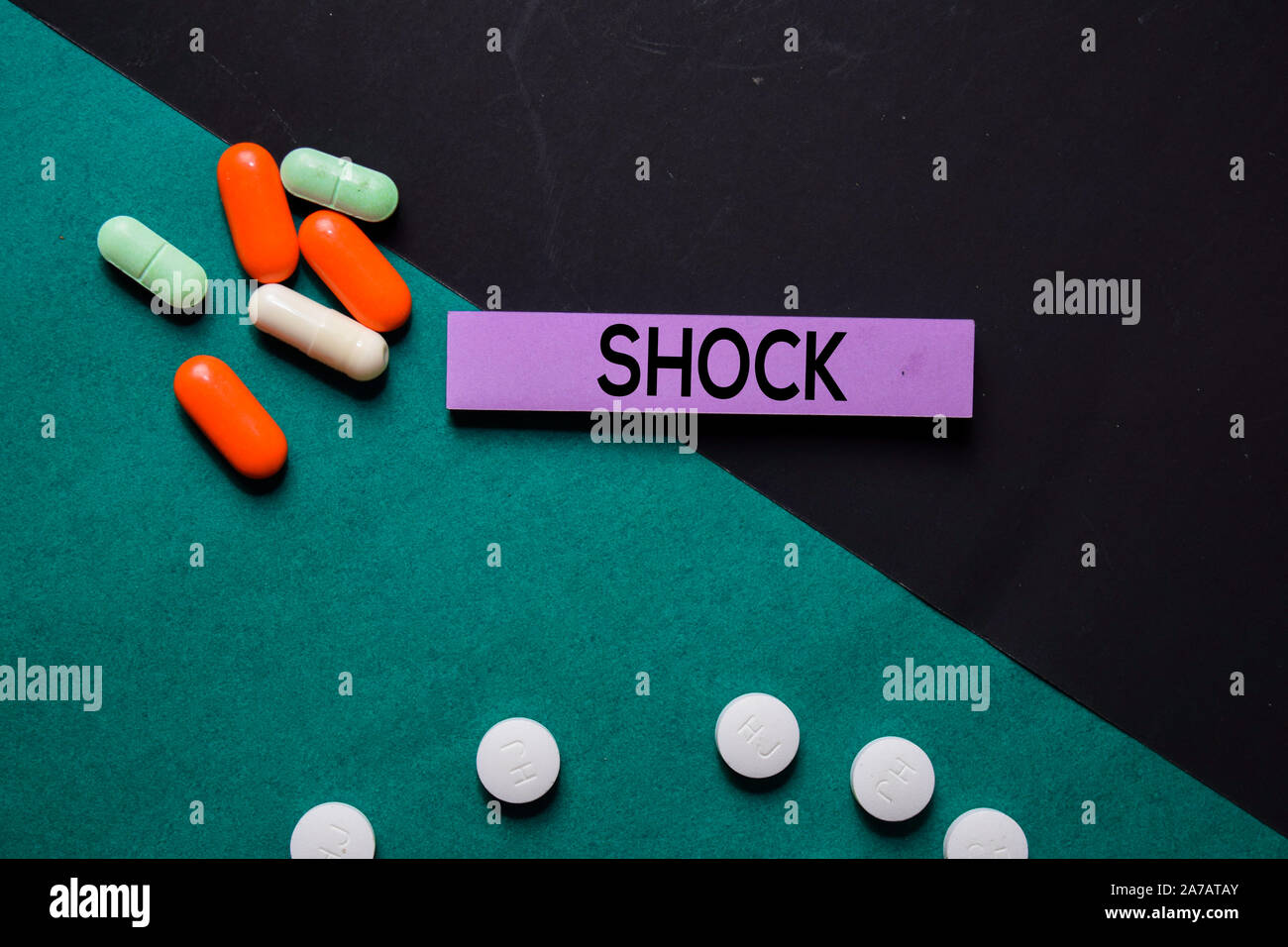 Shock text on sticky notes. Office desk background. Medical or ...