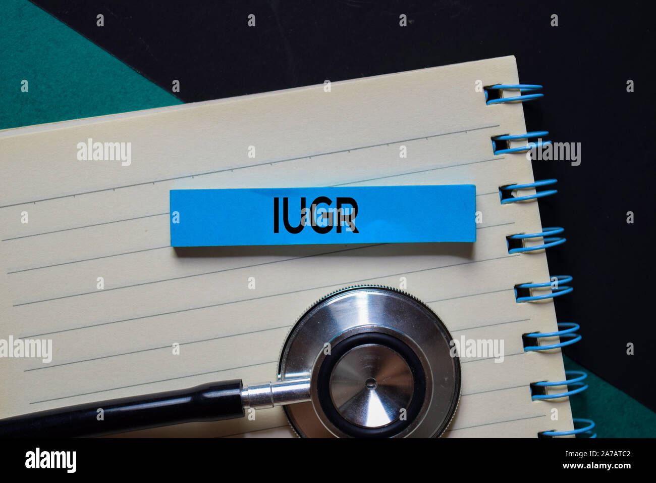 IUGR text on sticky notes. Office desk background. Medical or ...