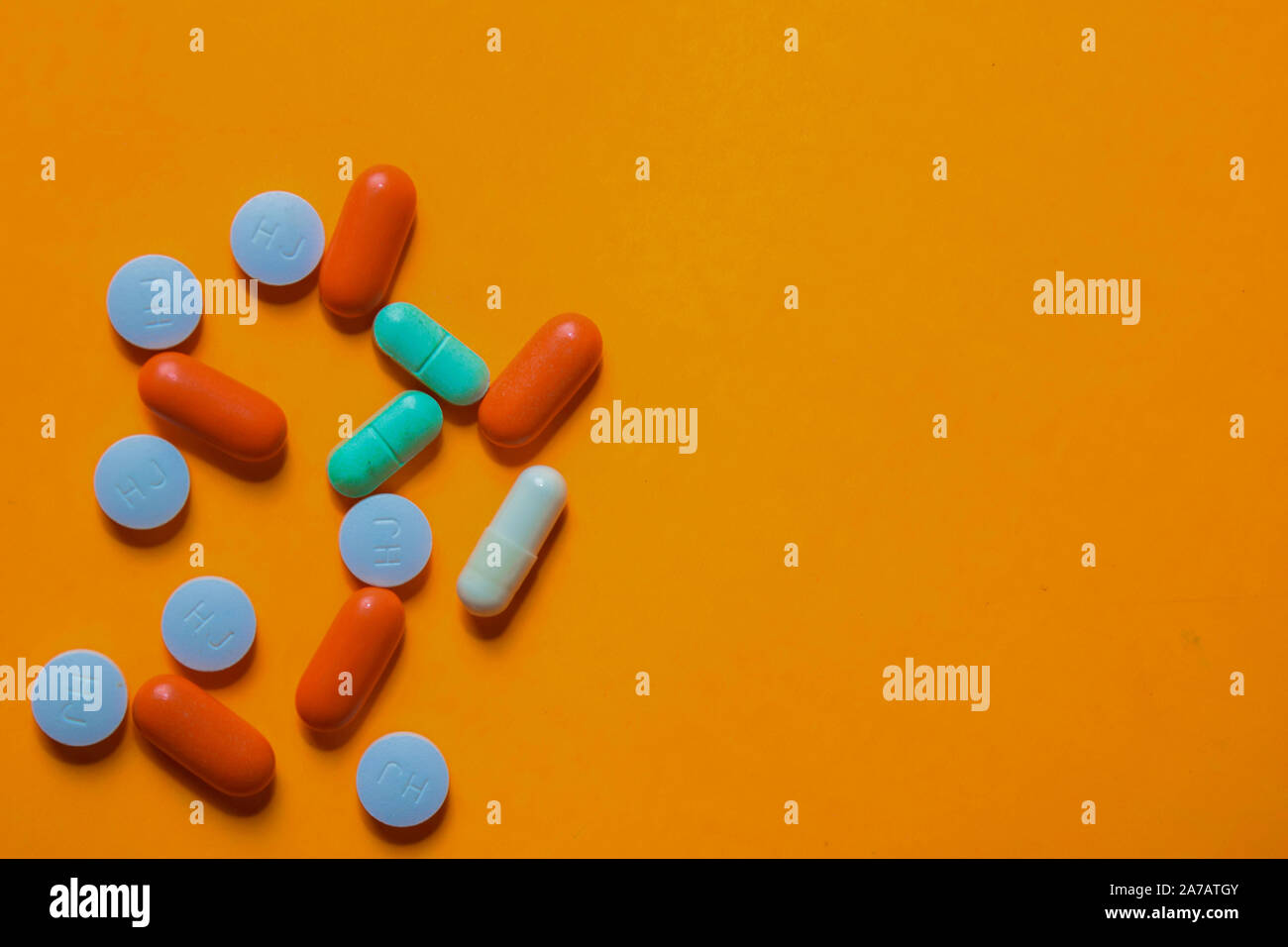 colorful medication and medicine pills, tablets and capsules. Isolated ...