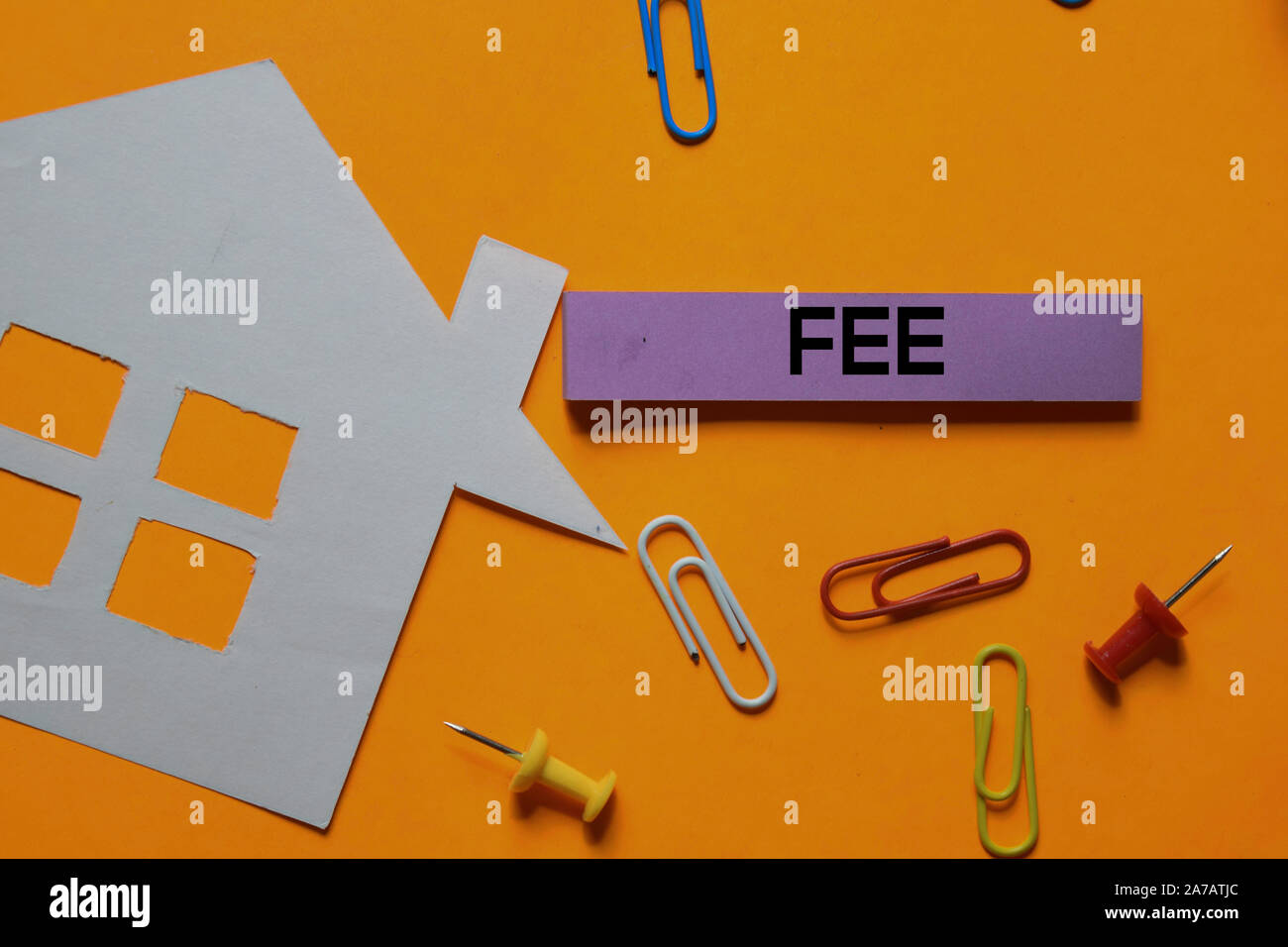 Fee text on sticky notes. Office desk background Stock Photo - Alamy