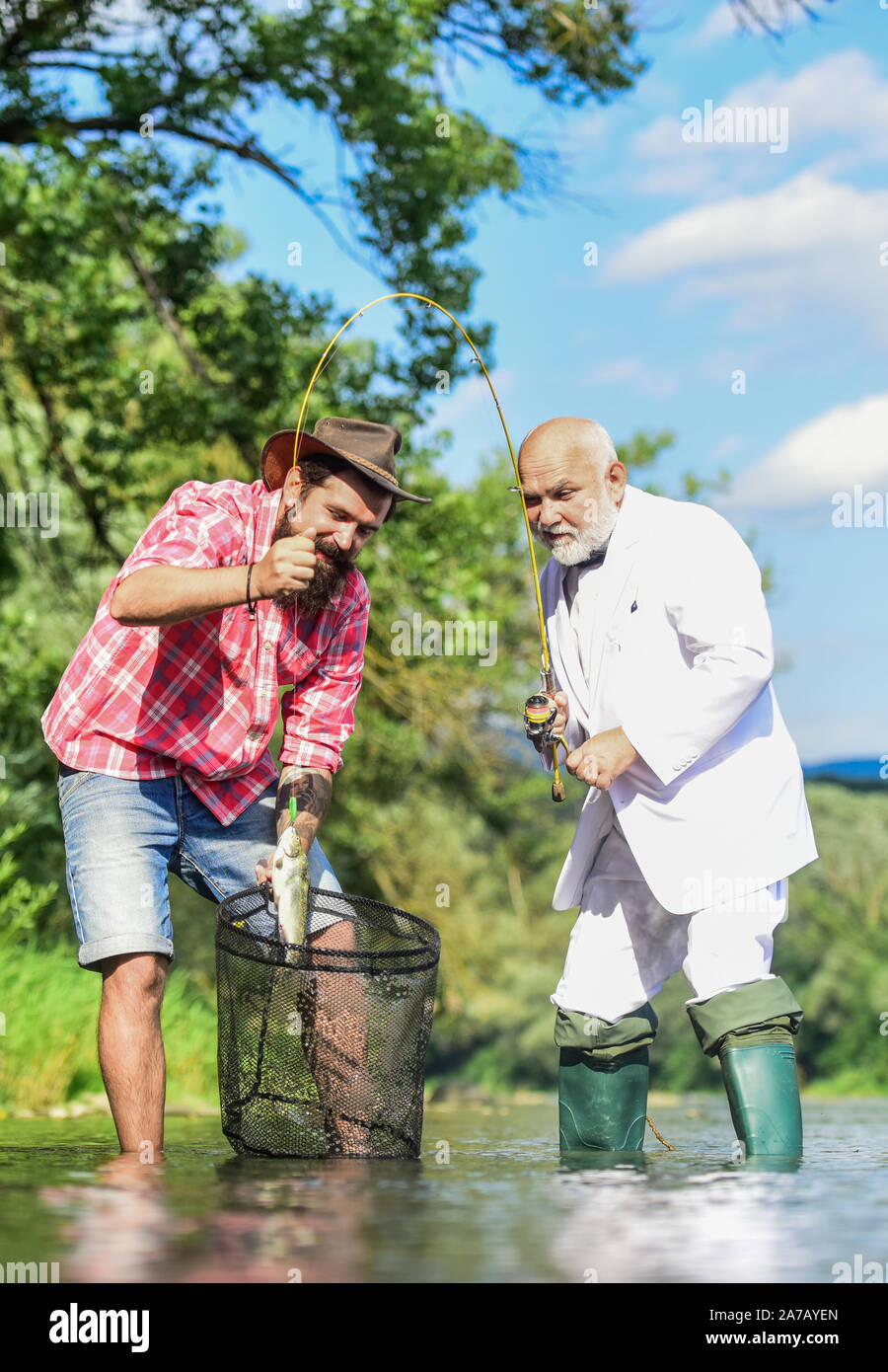 Catching fish with soulmate. Friends catching fish. Fish trapped in net ...
