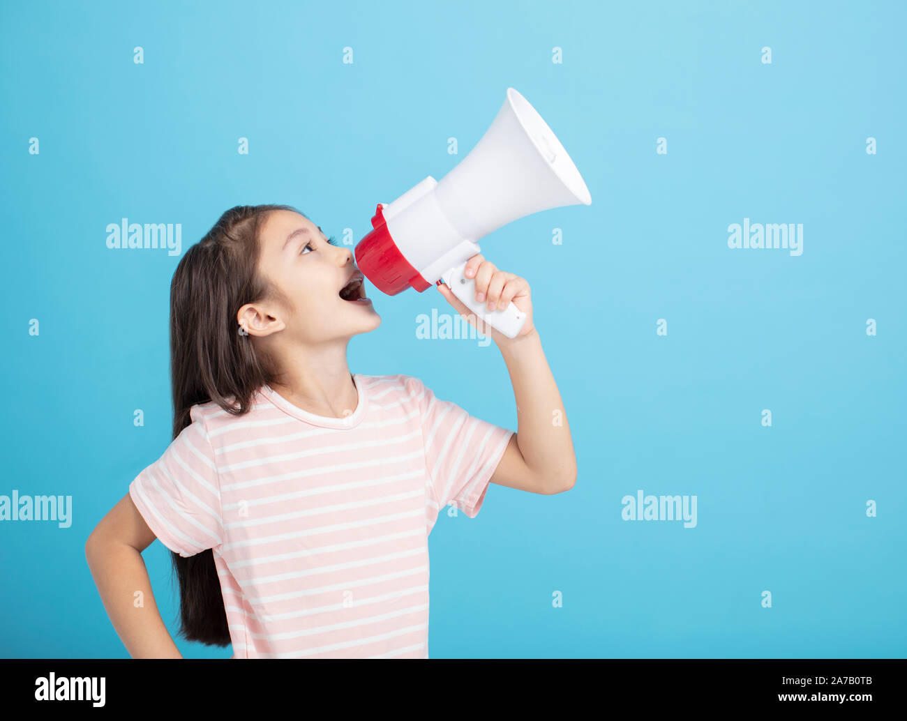 Little girl screaming and shouting with megaphone Stock Photo - Alamy