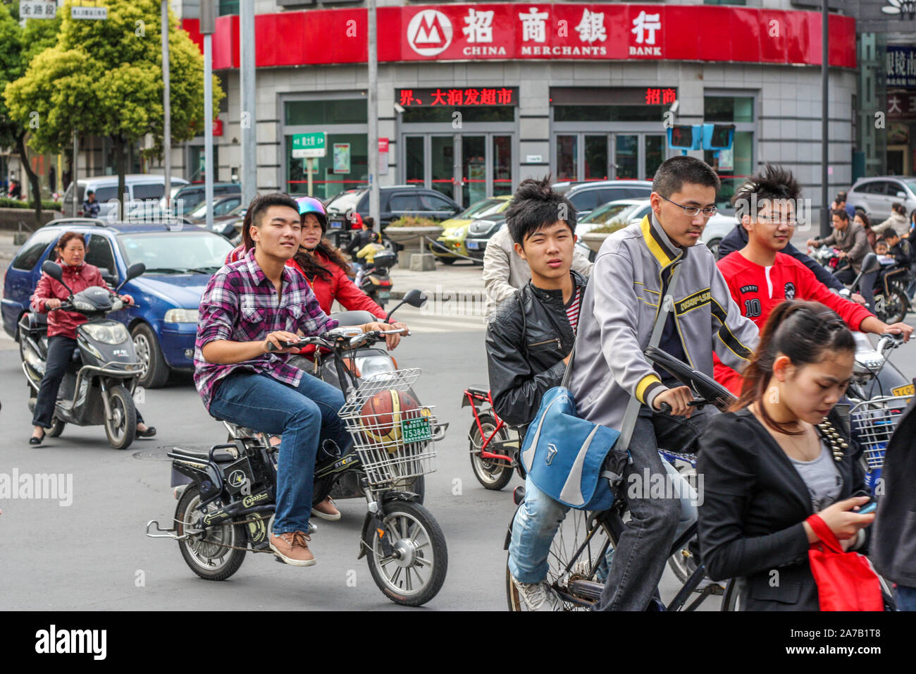 Asian Chinese cyclists and motor riders, morning heavy traffic in China ...