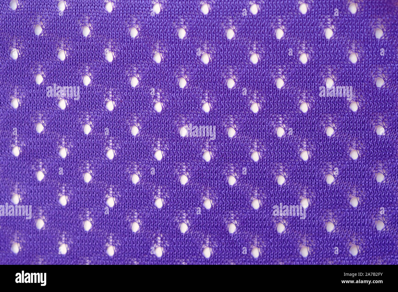 Purple fabric sport clothing football jersey with air mesh close up ...