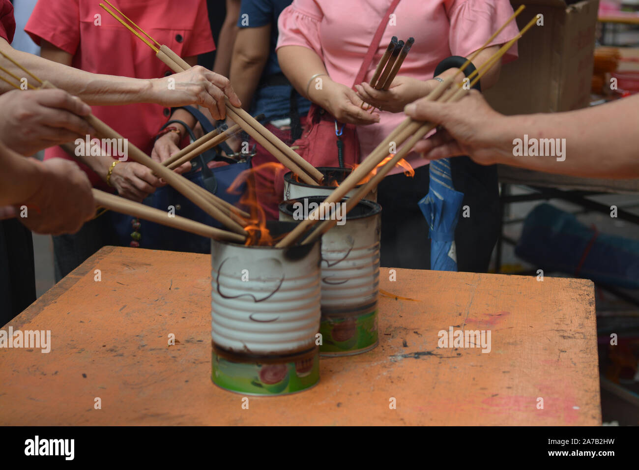 Burning of joss sticks. Asian Chinese custom Stock Photo - Alamy