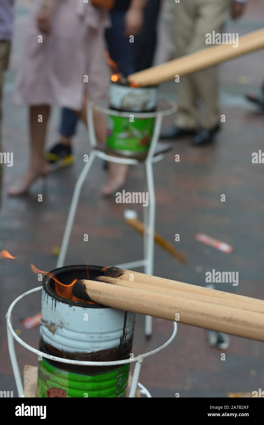 Burning of joss sticks. Asian Chinese custom Stock Photo - Alamy
