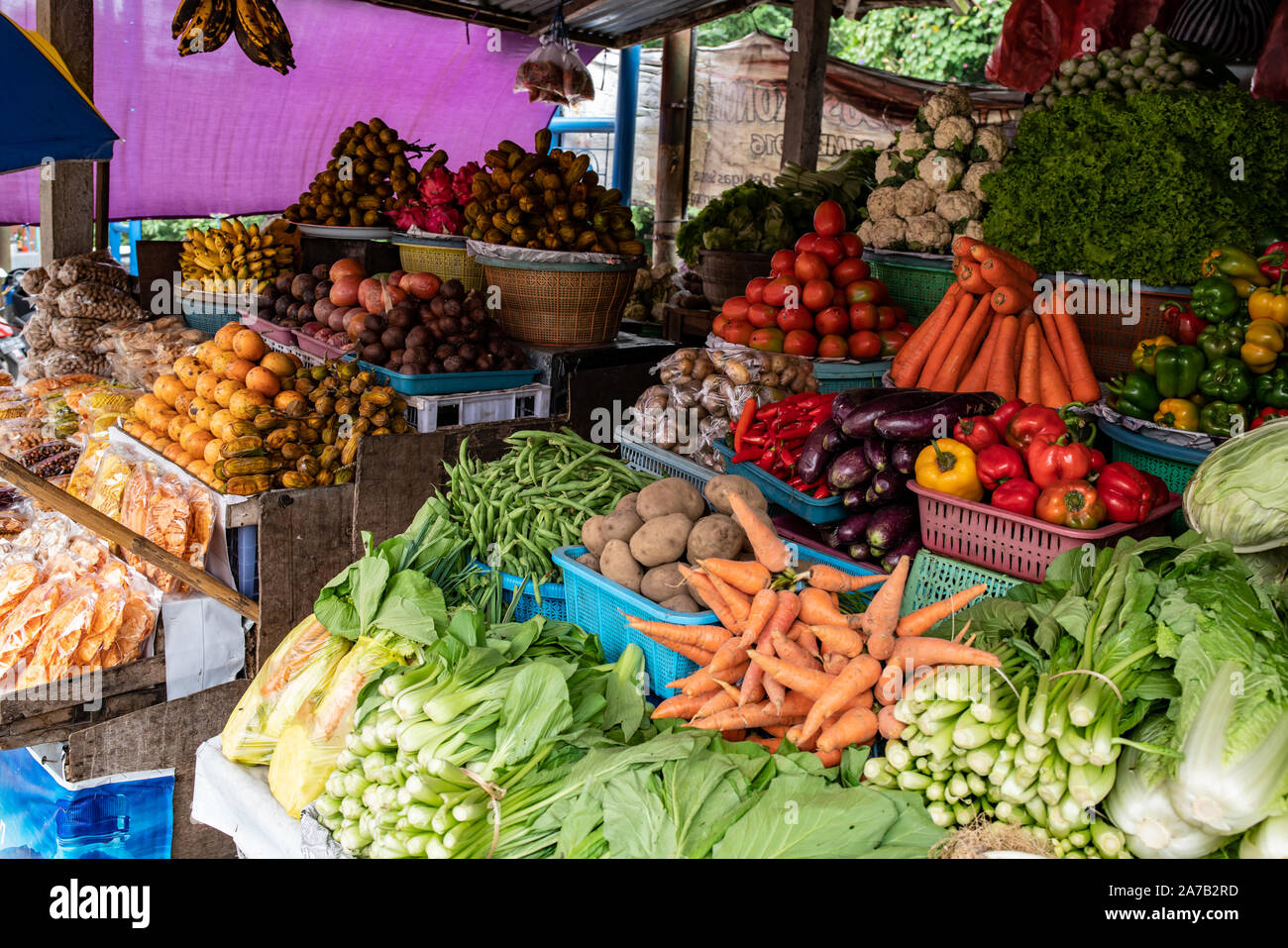 Vibrant Fresh fruit and vegetable stall at the Tabanan village market ...