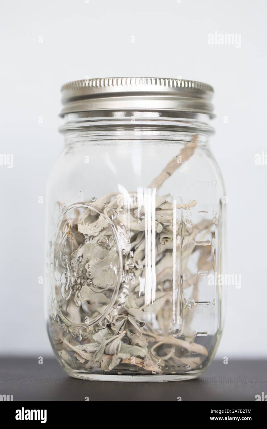 A mason jar of white ceremonial sage Stock Photo - Alamy