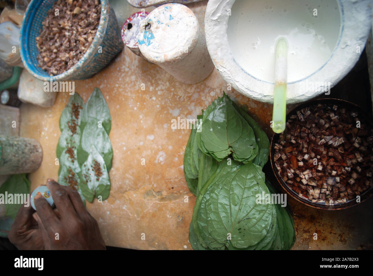 Man making betel nut on the street stall in Yangon, Myanmar, Asia Stock ...