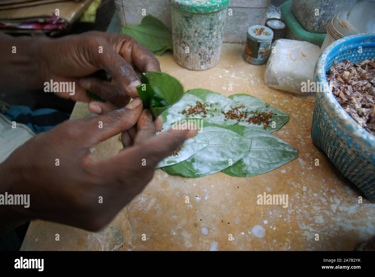 Man making betel nut on the street stall in Yangon, Myanmar, Asia Stock ...