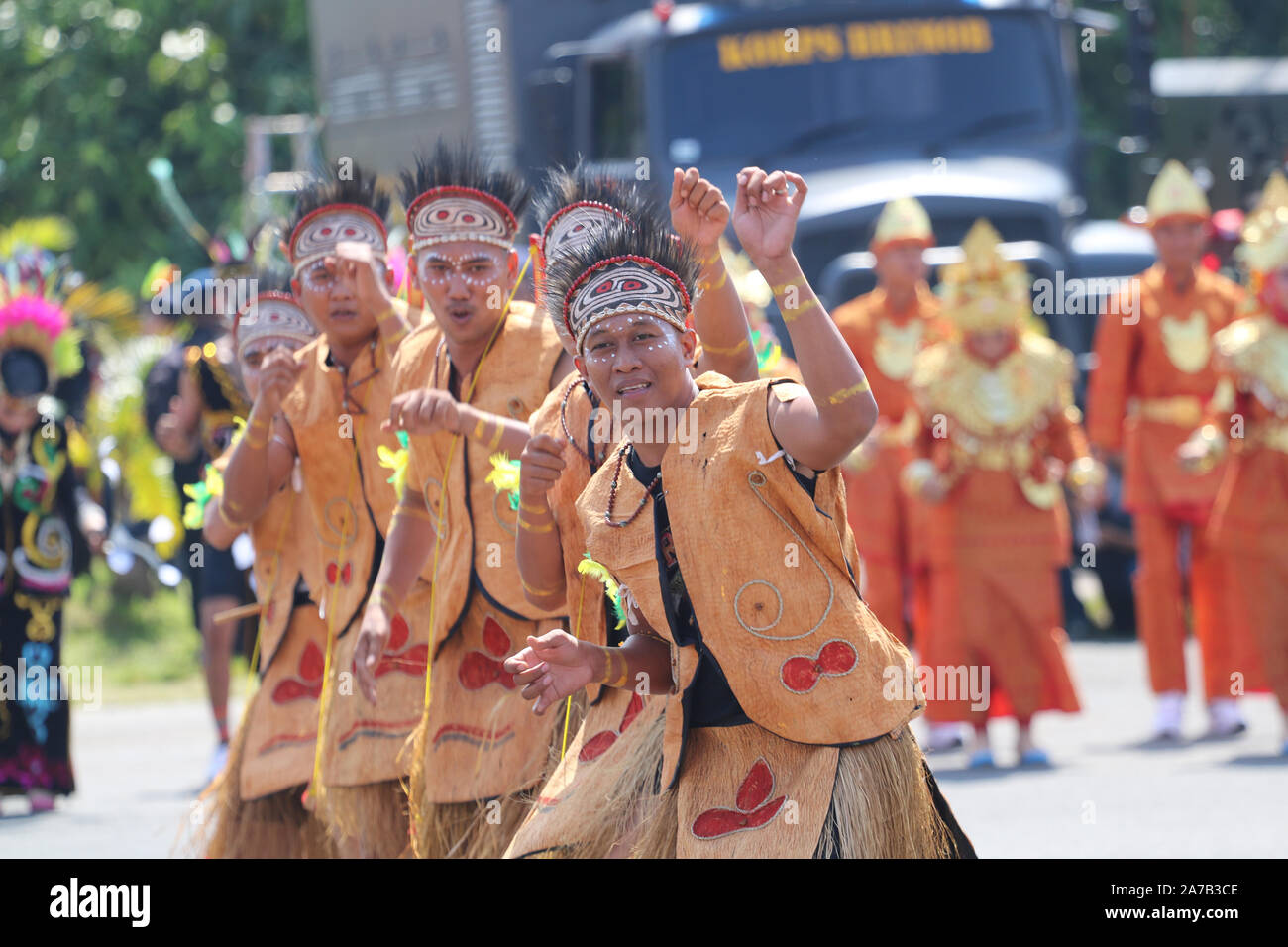 A number of dancers are performing traditional Indonesian dances at ...