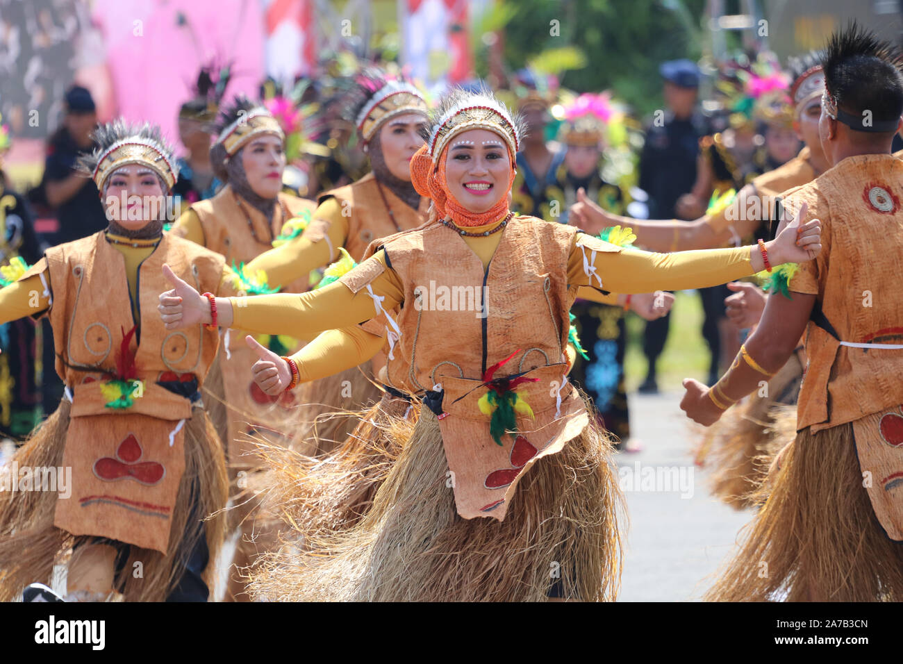 A number of dancers are performing traditional Indonesian dances at ...