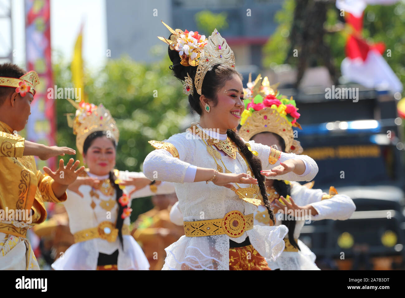 A number of dancers are performing traditional Indonesian dances at ...