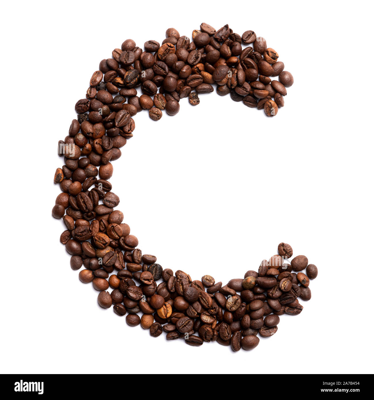 Letter C of the English alphabet of freshly roasted cocoa beans on a ...