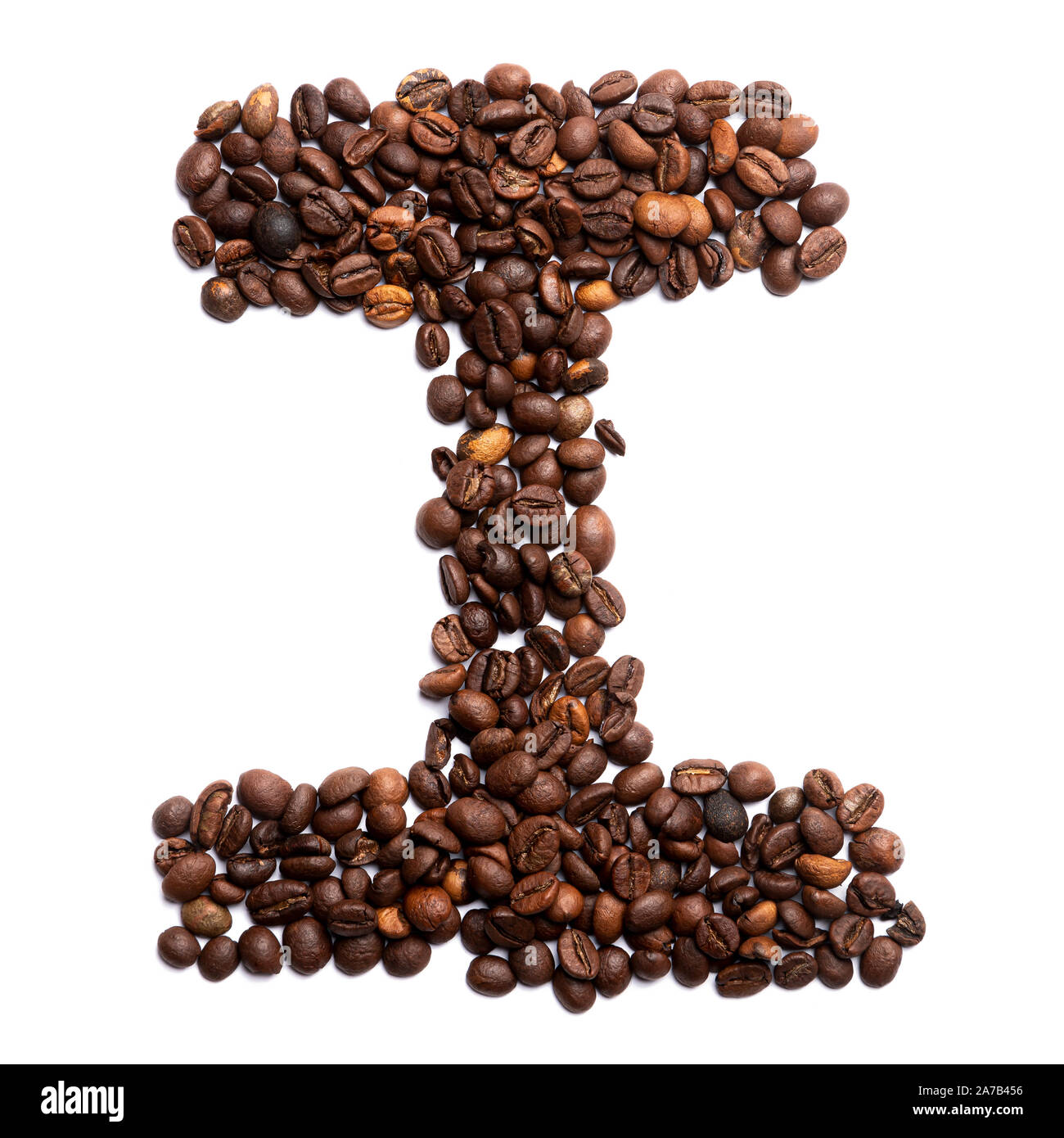 Letter I of the English alphabet of freshly roasted cocoa beans on a ...