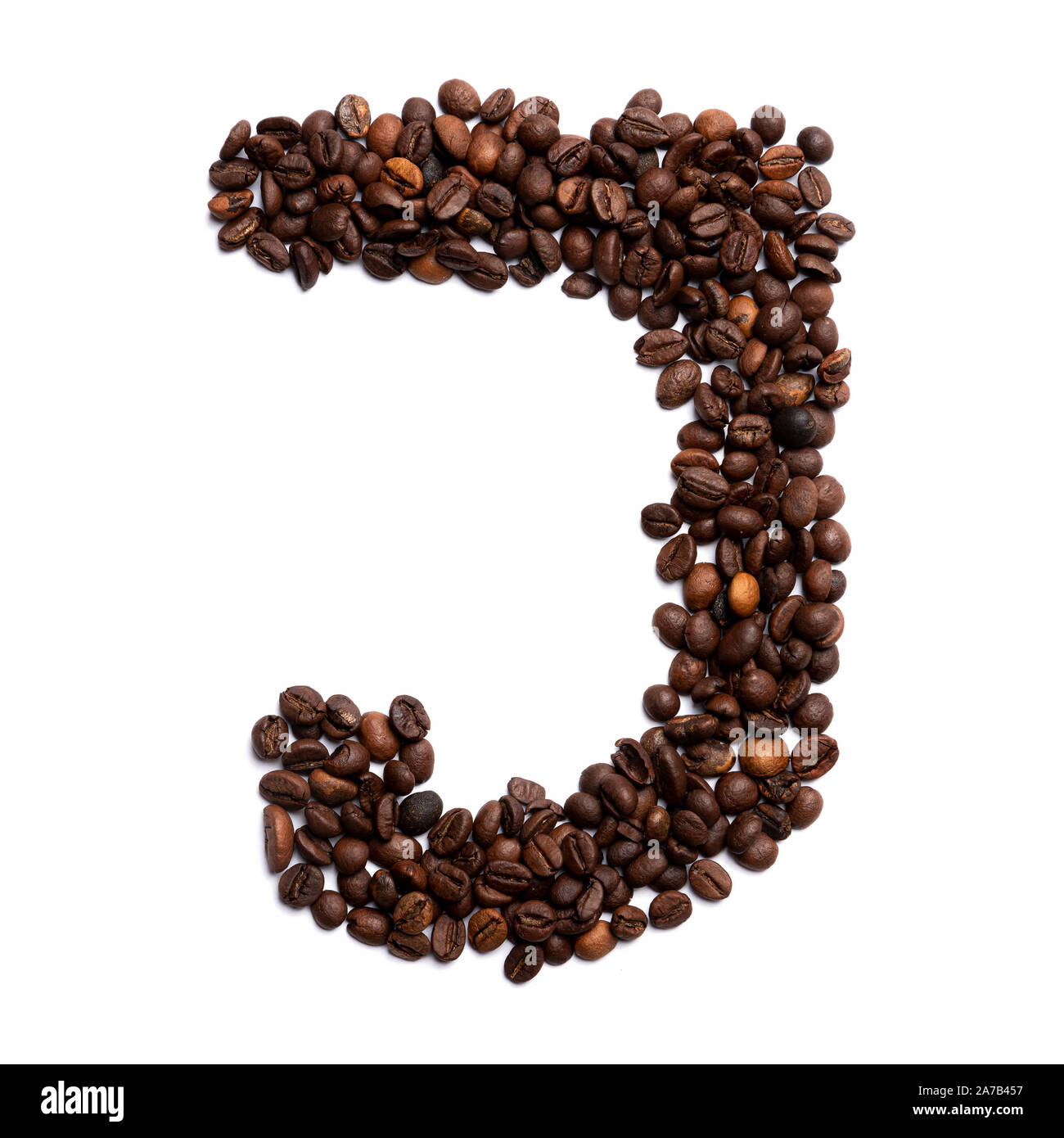 Letter J of the English alphabet of freshly roasted cocoa beans on a ...