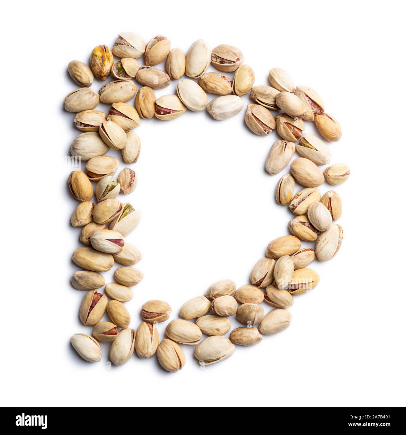 The letter "D" of the English alphabet from a unpeeled pistachios on a ...
