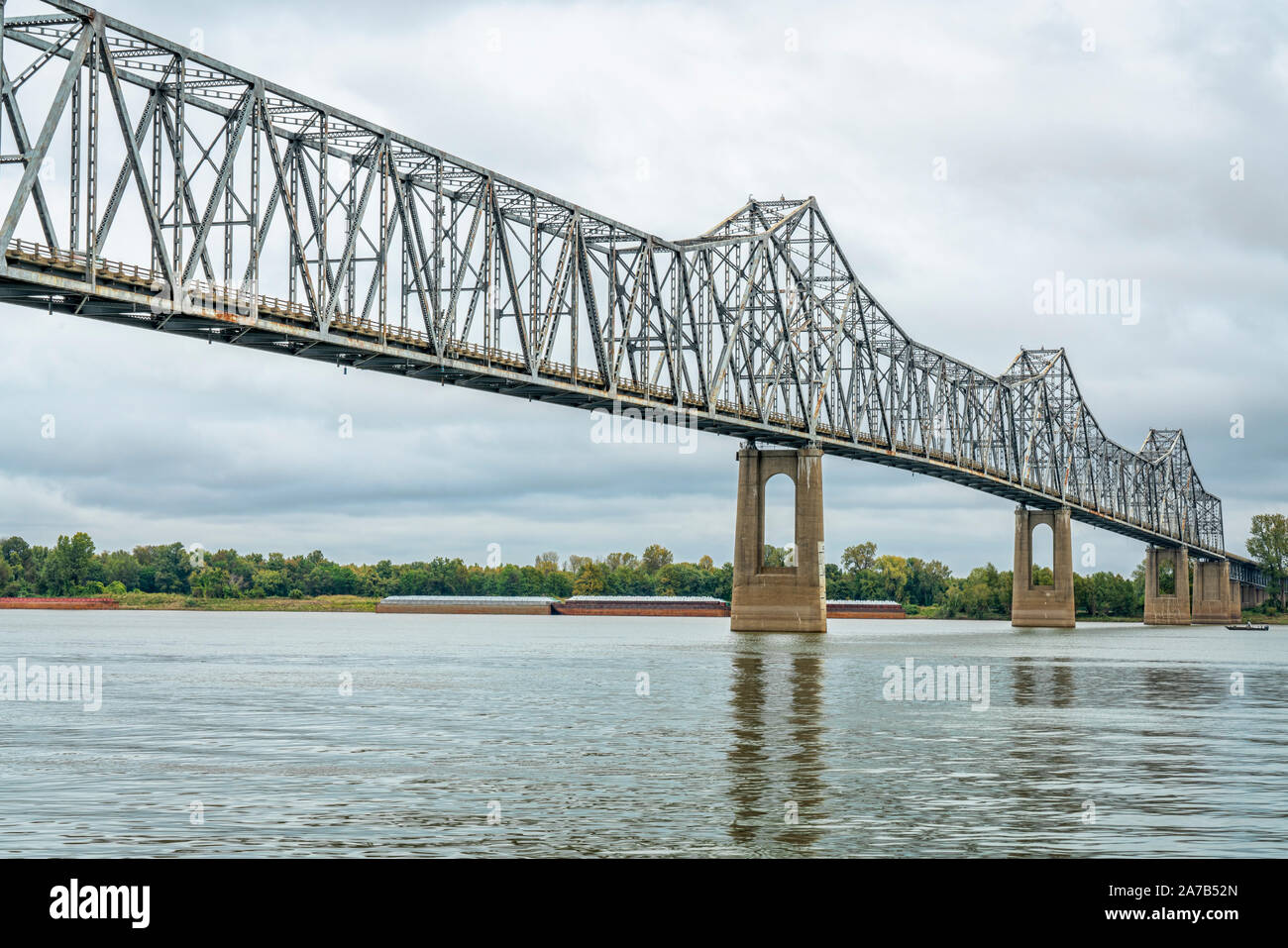 cantilever Cairo Ohio River Bridge in fall scenery with river barges in ...
