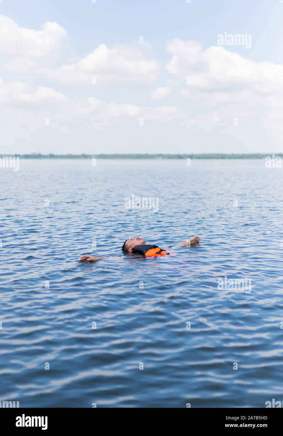 Man take a rest by floating on Water surface relax concept Stock Photo ...