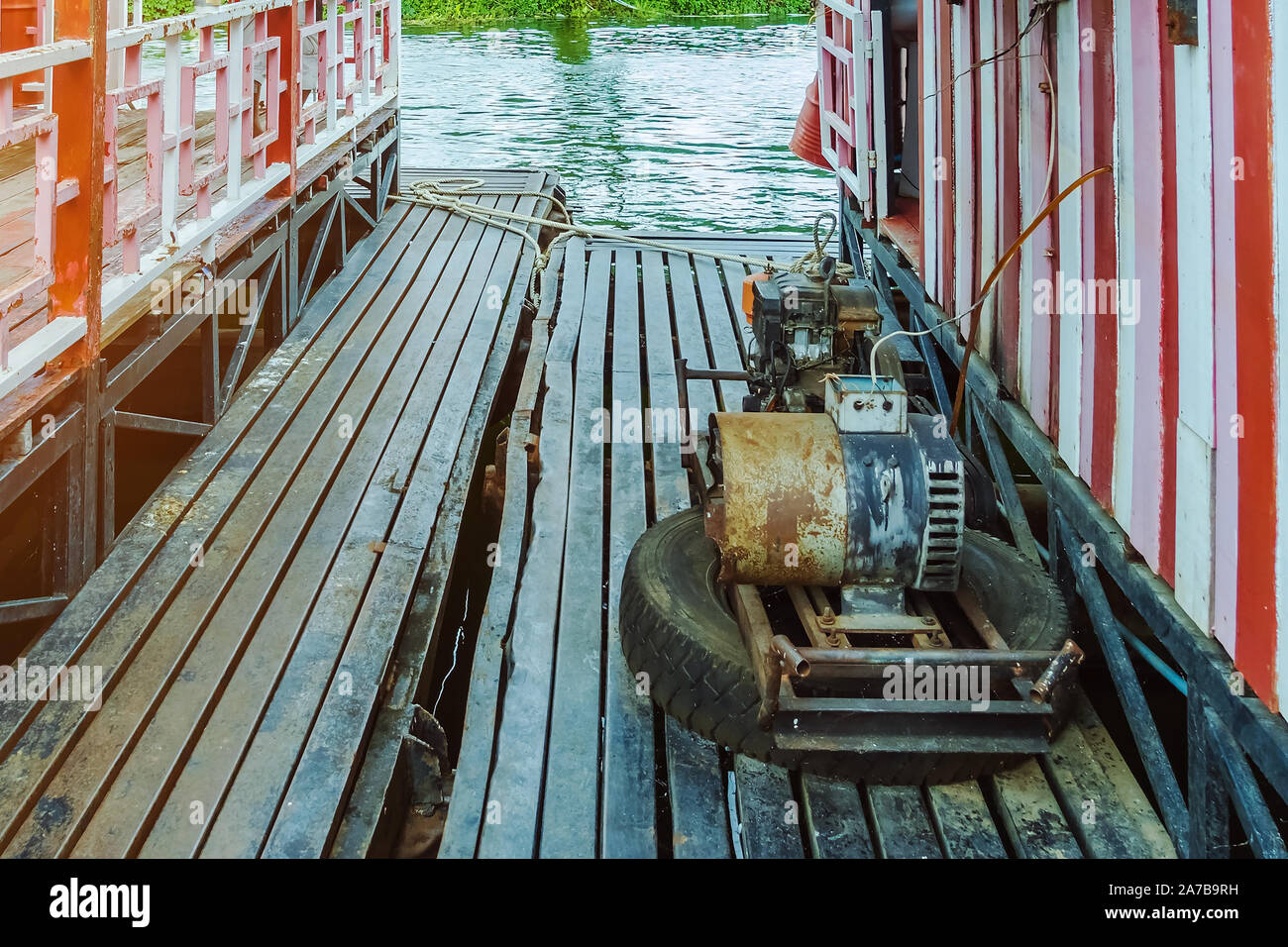 The old electricity generator for floating wooden raft house by using ...