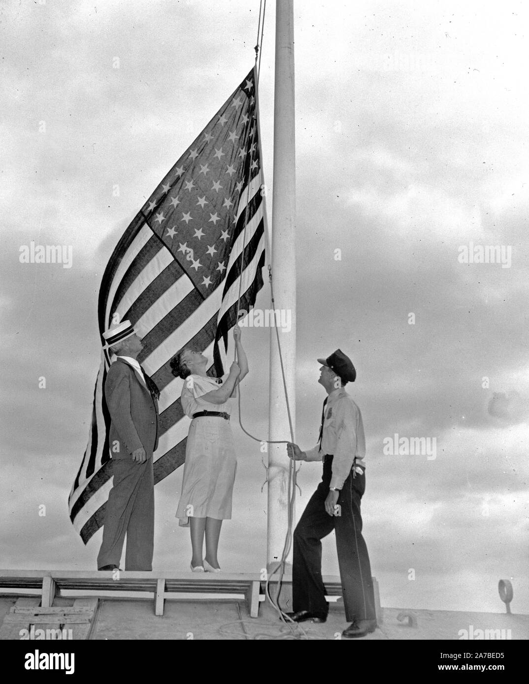 1930s lowering american flag hi-res stock photography and images - Alamy