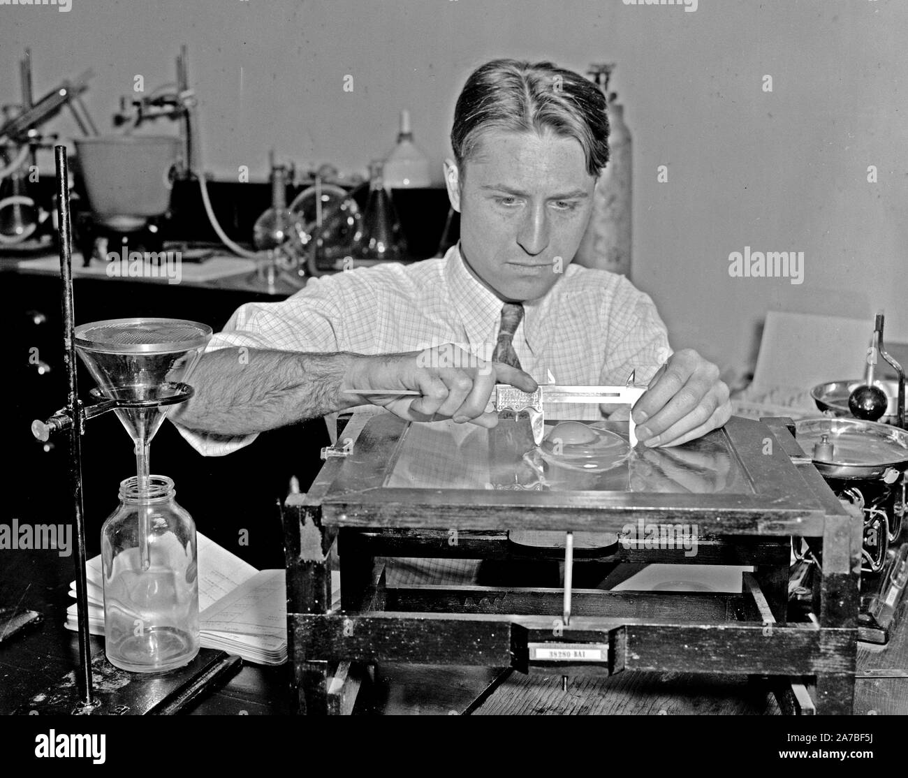 This picture of Charles A. Denton, Junior Chemist, at the nutrition ...