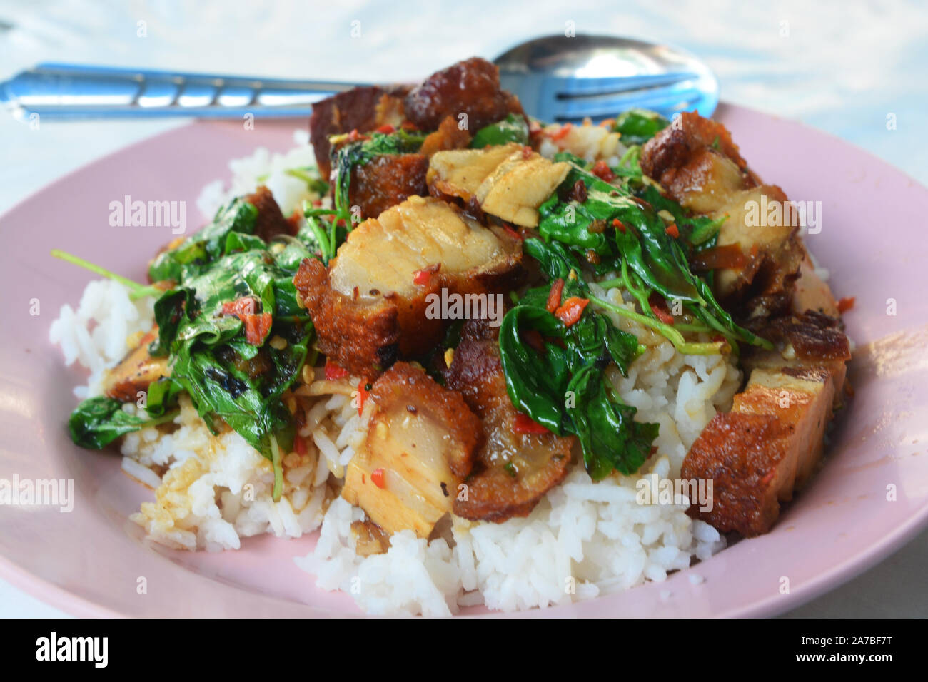 Crispy Pork with Thai Basil (Kra Pao Moo Grob Stock Photo - Alamy