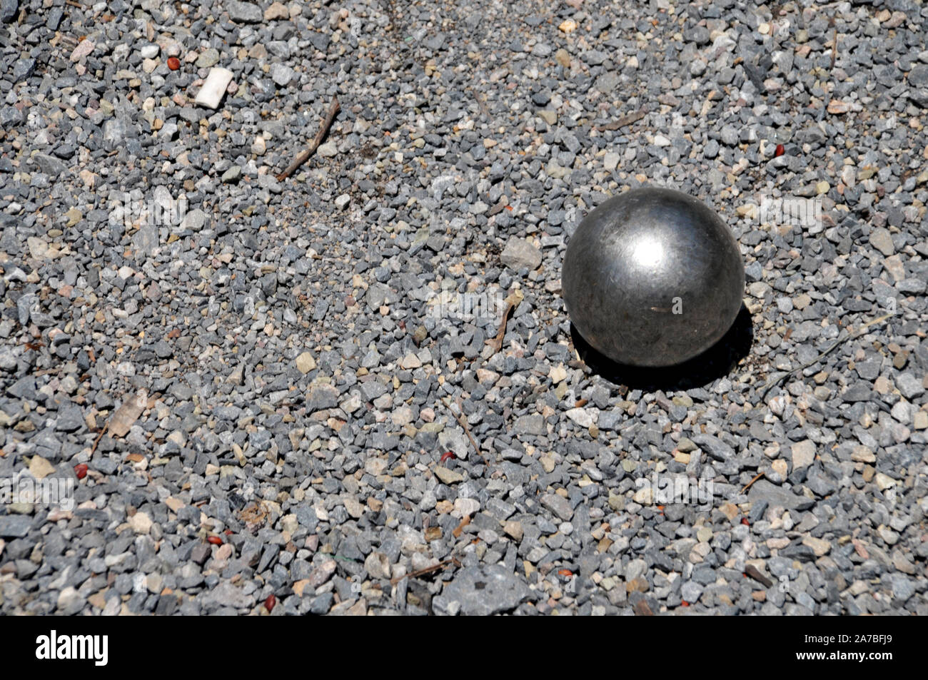 Metallic petanque ball on the ground Stock Photo - Alamy