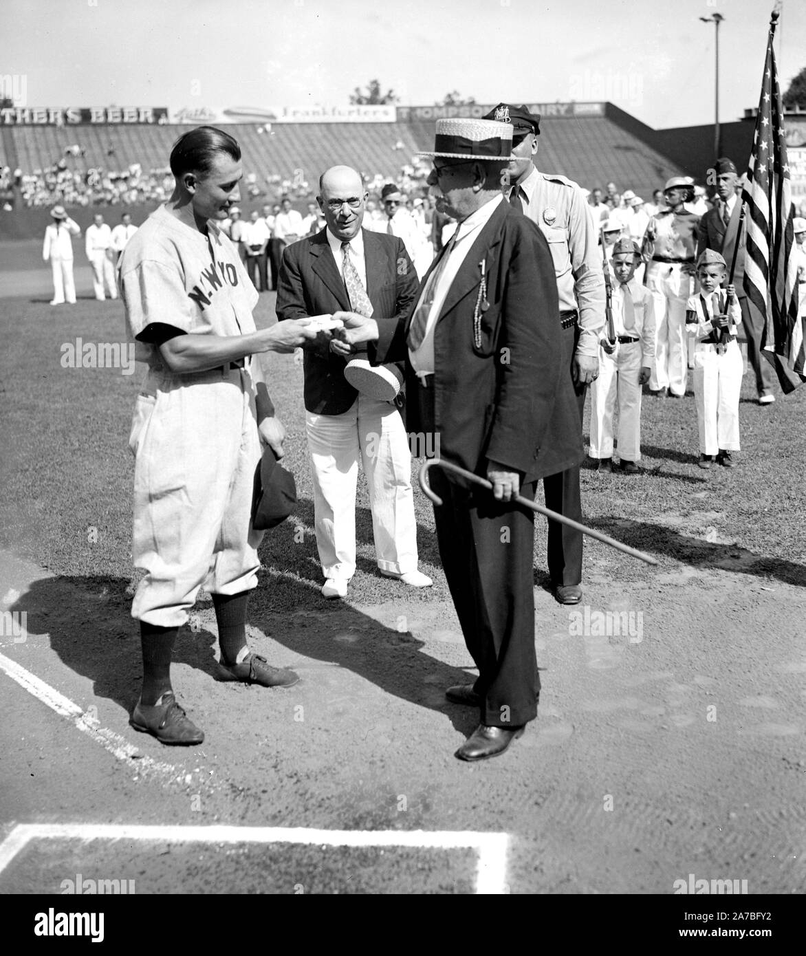 Jake Powell, New York Yankee outfielder, was presented with a wallet ...
