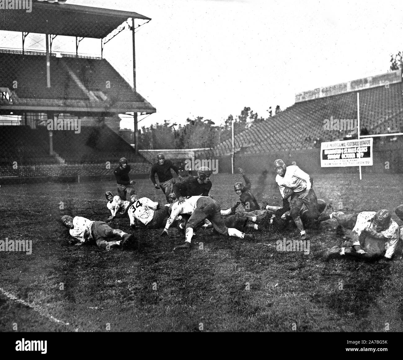 1930s football game being played in empty stadium ca. 1936 Stock Photo ...