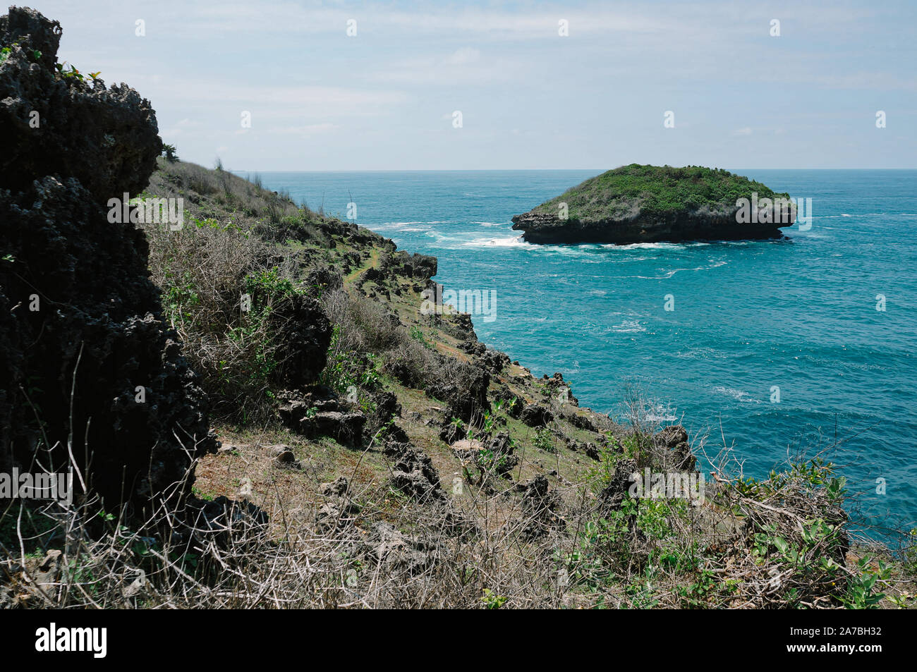 Small karst island in Indian ocean looked from Srau beach, Pacitan ...