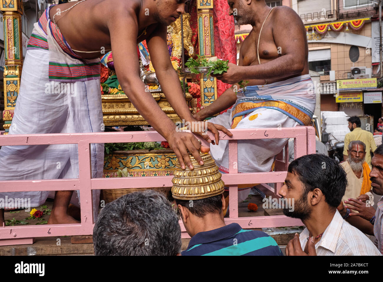 During a procession in honor of Hindu god Venkateshwara, a priest ...