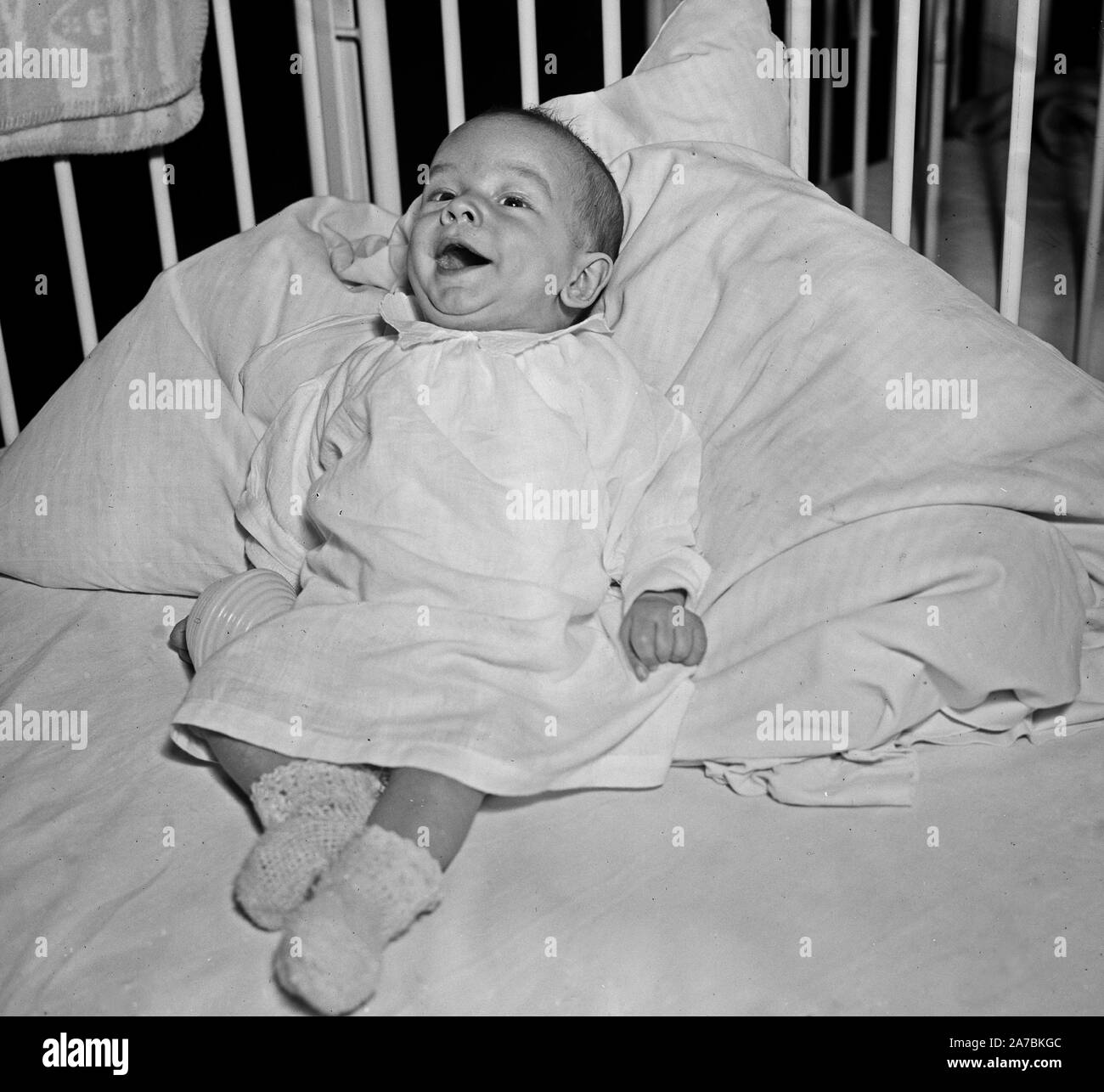 Toddler in a crib ca. 1935 Stock Photo - Alamy