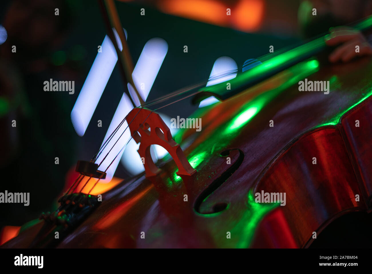 Cellist and violinist playing at the concert Stock Photo - Alamy