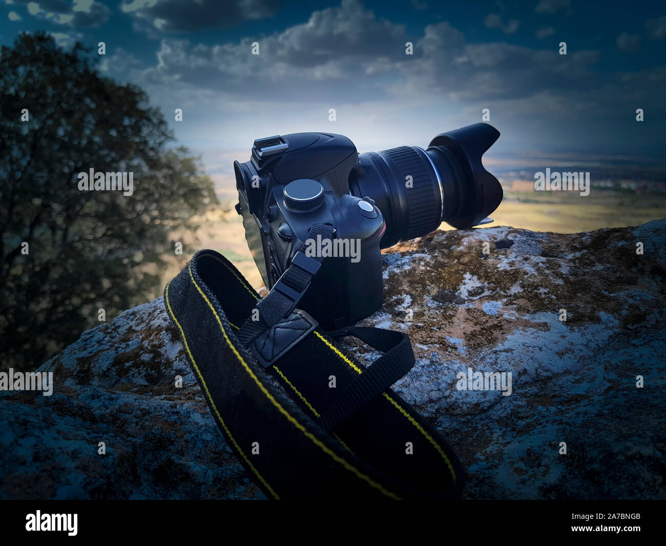 Camera set on a mountain stone Stock Photo - Alamy