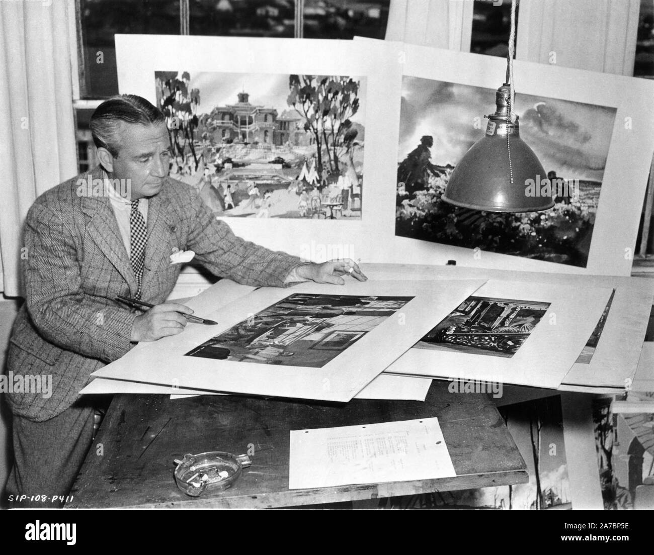 Production Designer WILLIAM CAMERON MENZIES with concept art for GONE ...