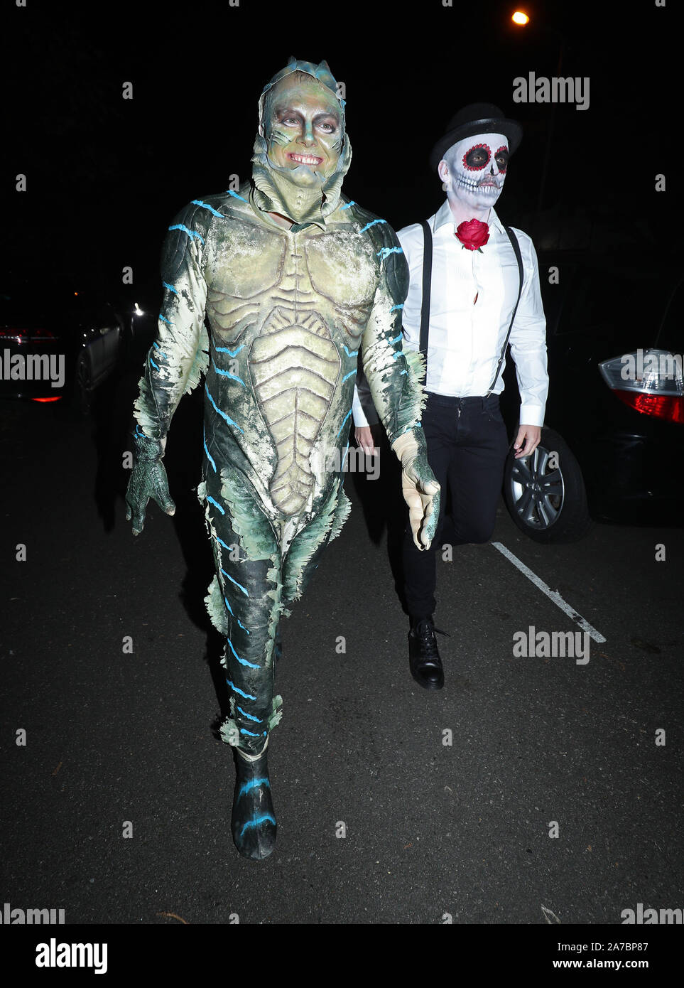 Alan Carr (left) and his husband Paul Drayton arriving at a Halloween ...