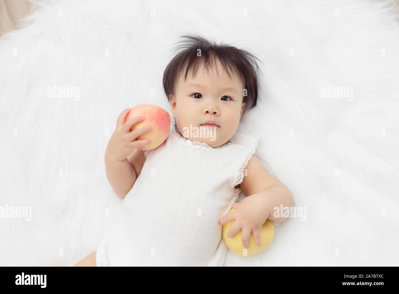 Happy baby child play fun in bed Stock Photo - Alamy