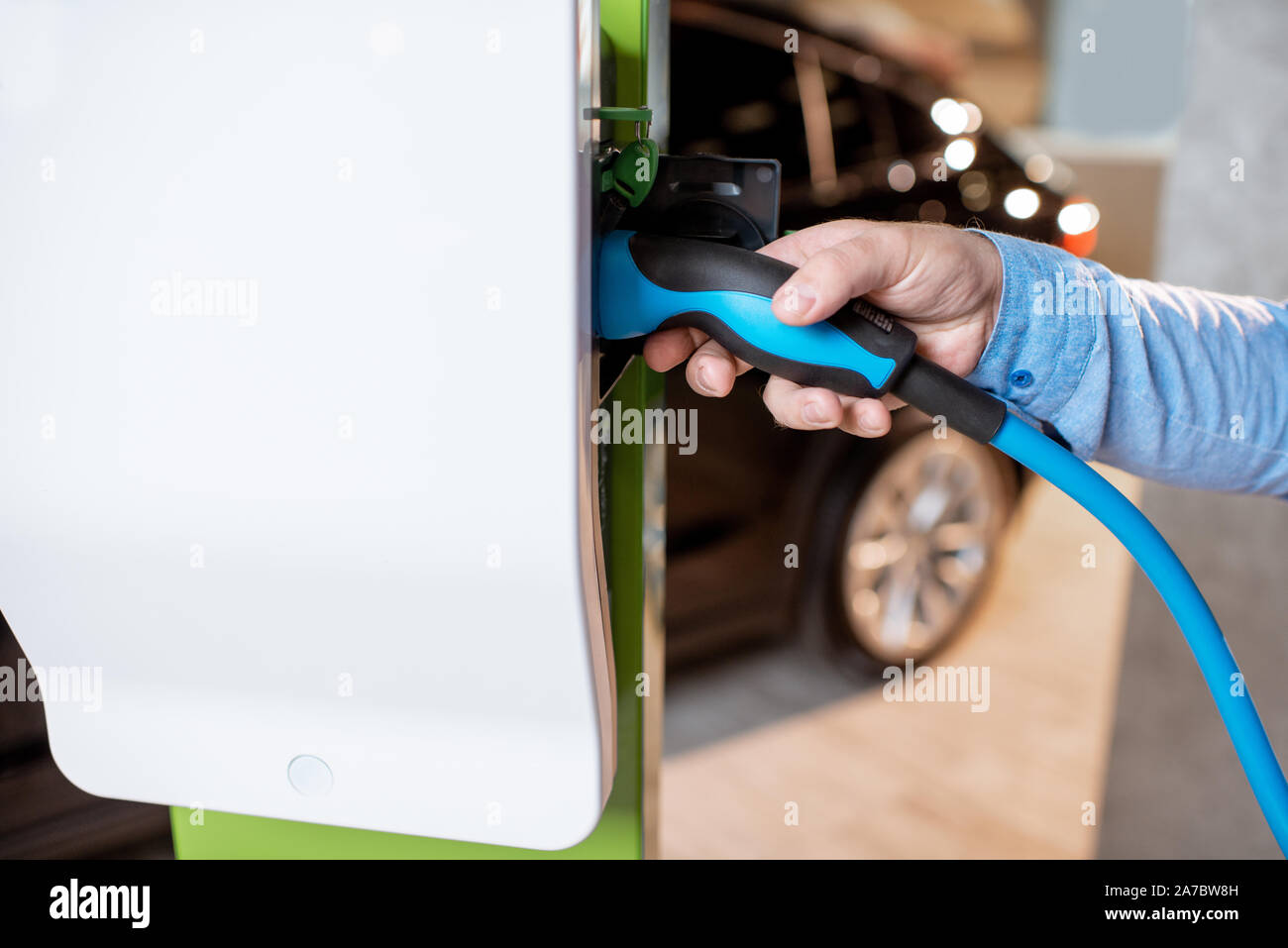 Close view man plugging charging hi-res stock photography and images ...