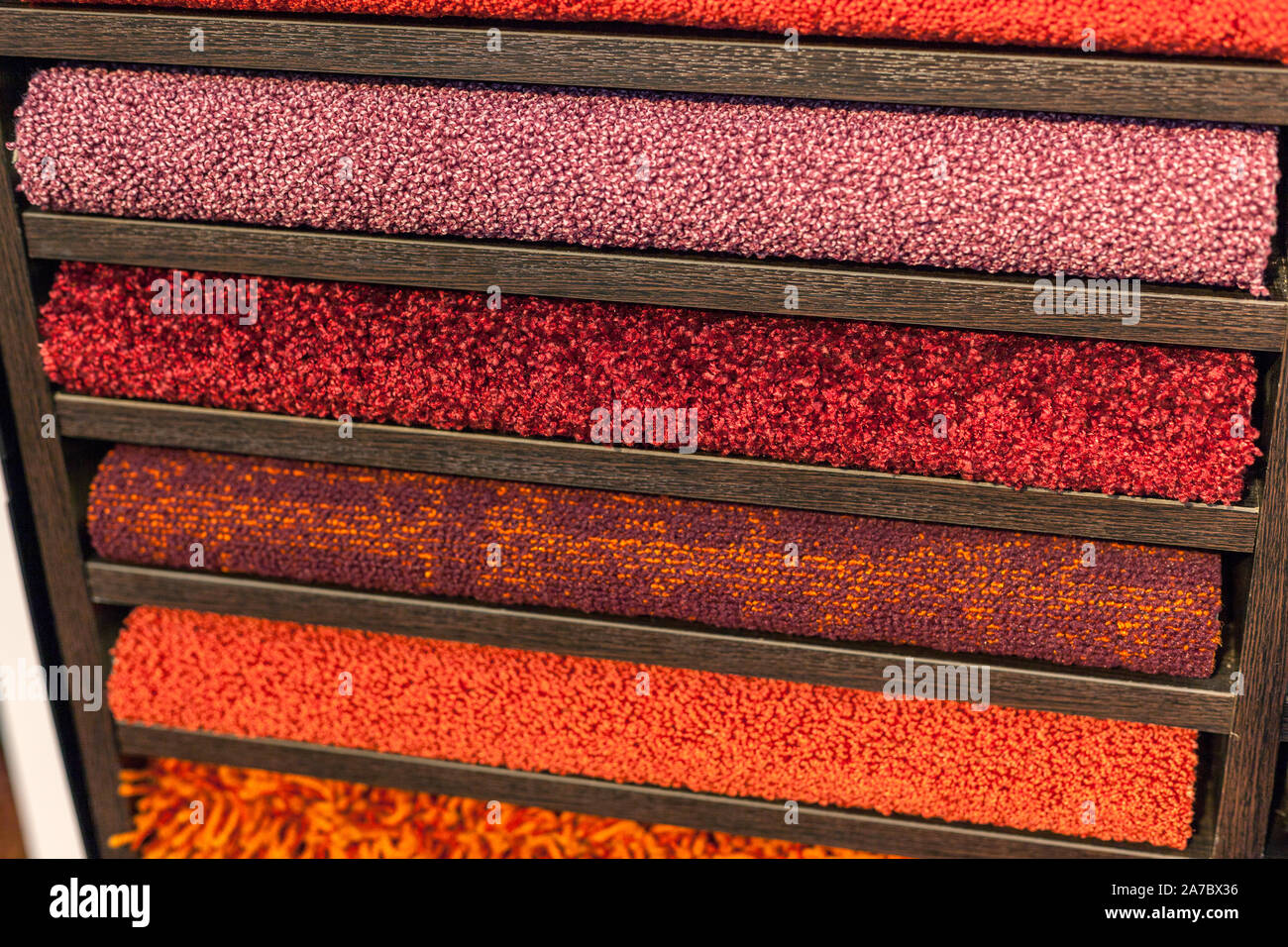 samples of multi-colored carpets on the shelves Stock Photo - Alamy