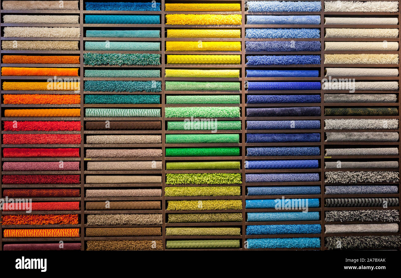 samples of multi-colored carpets on the shelves Stock Photo - Alamy