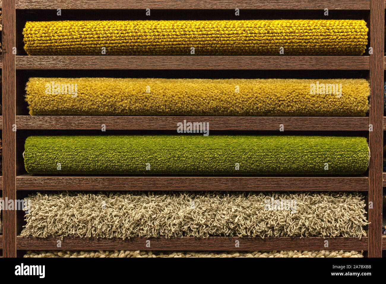 samples of multi-colored carpets on the shelves Stock Photo - Alamy