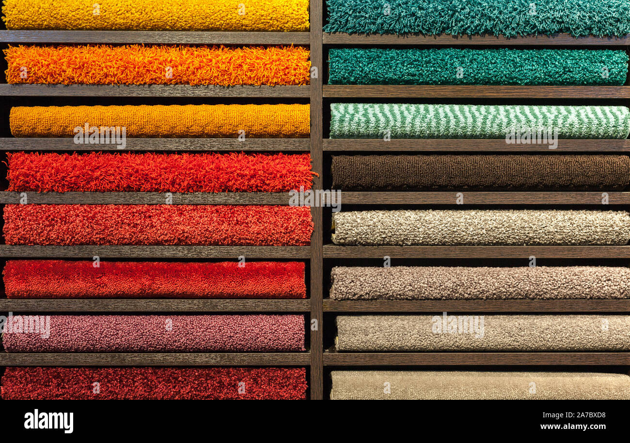 samples of multi-colored carpets on the shelves Stock Photo - Alamy